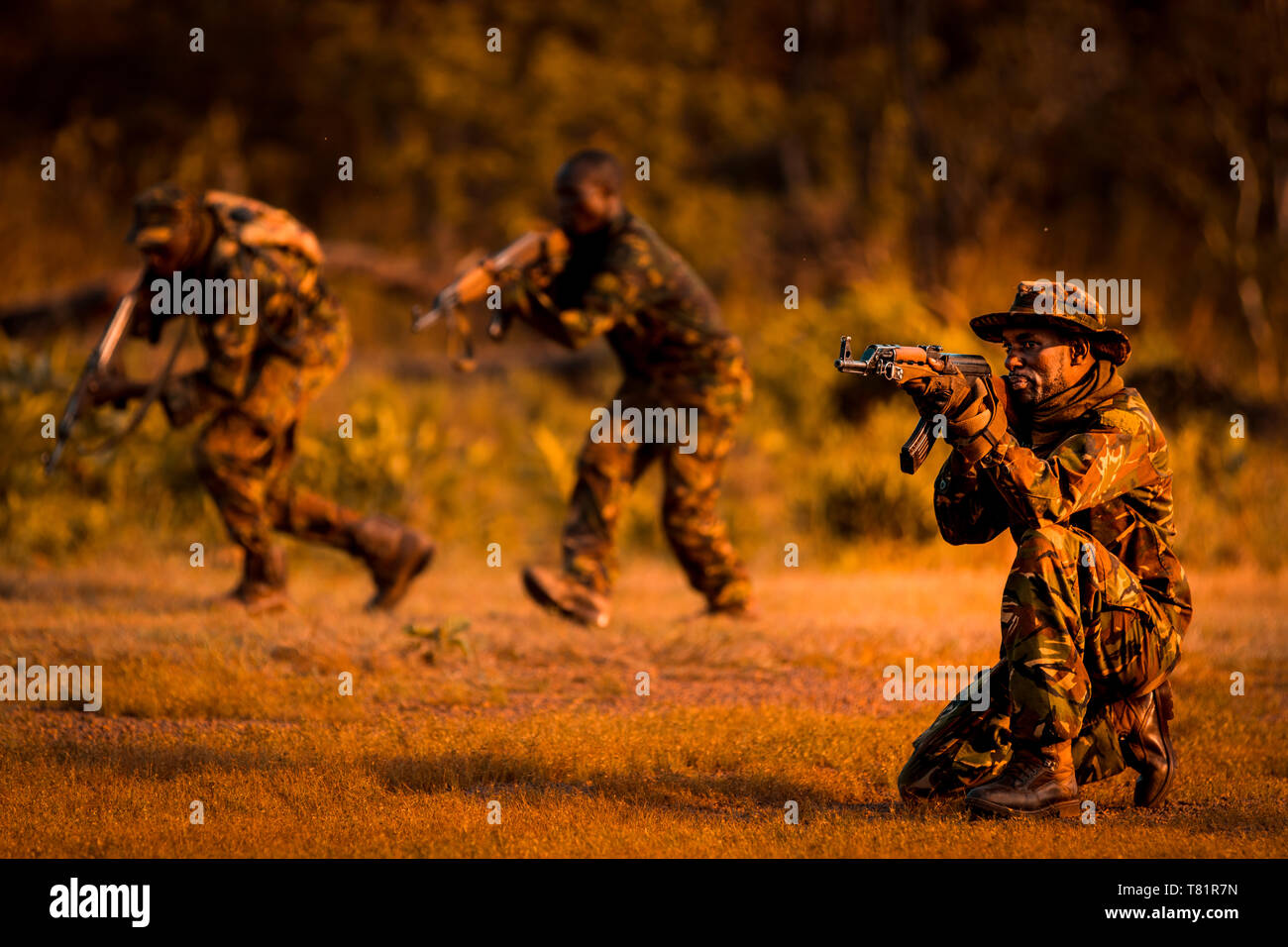 Rangers from Africa, in action, on patrol, in the grassland Stock Photo ...