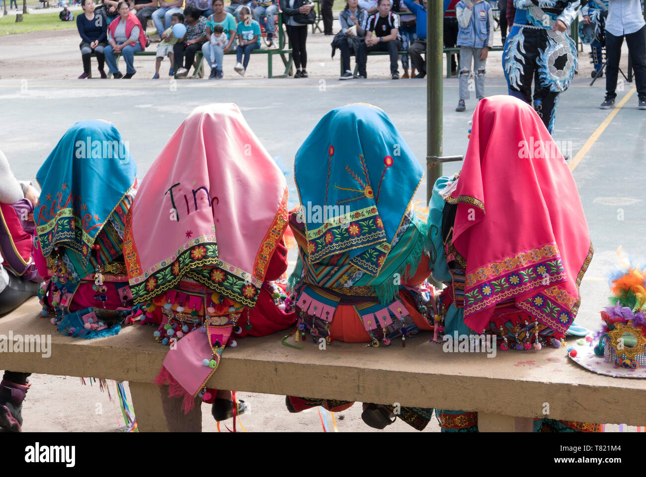 Parks are well used in Quito Ecuador, girls dance in national dress or ...