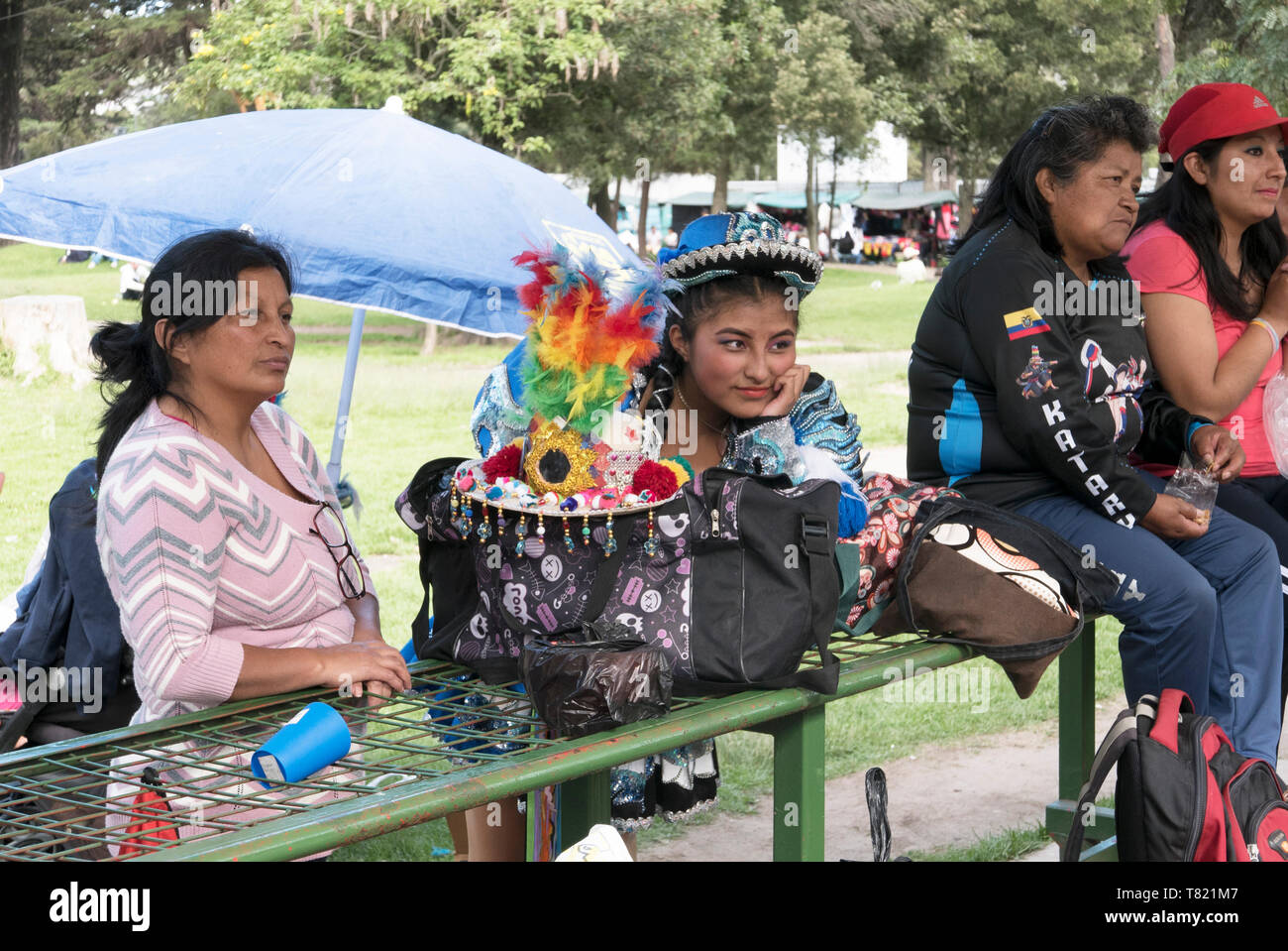 Parks are well used in Quito Ecuador, girls dance in national dress or ...
