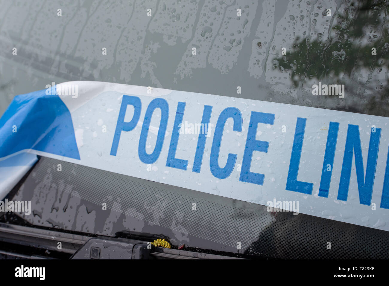 Police tape on a crashed vehicle after an accident. Car crash ...