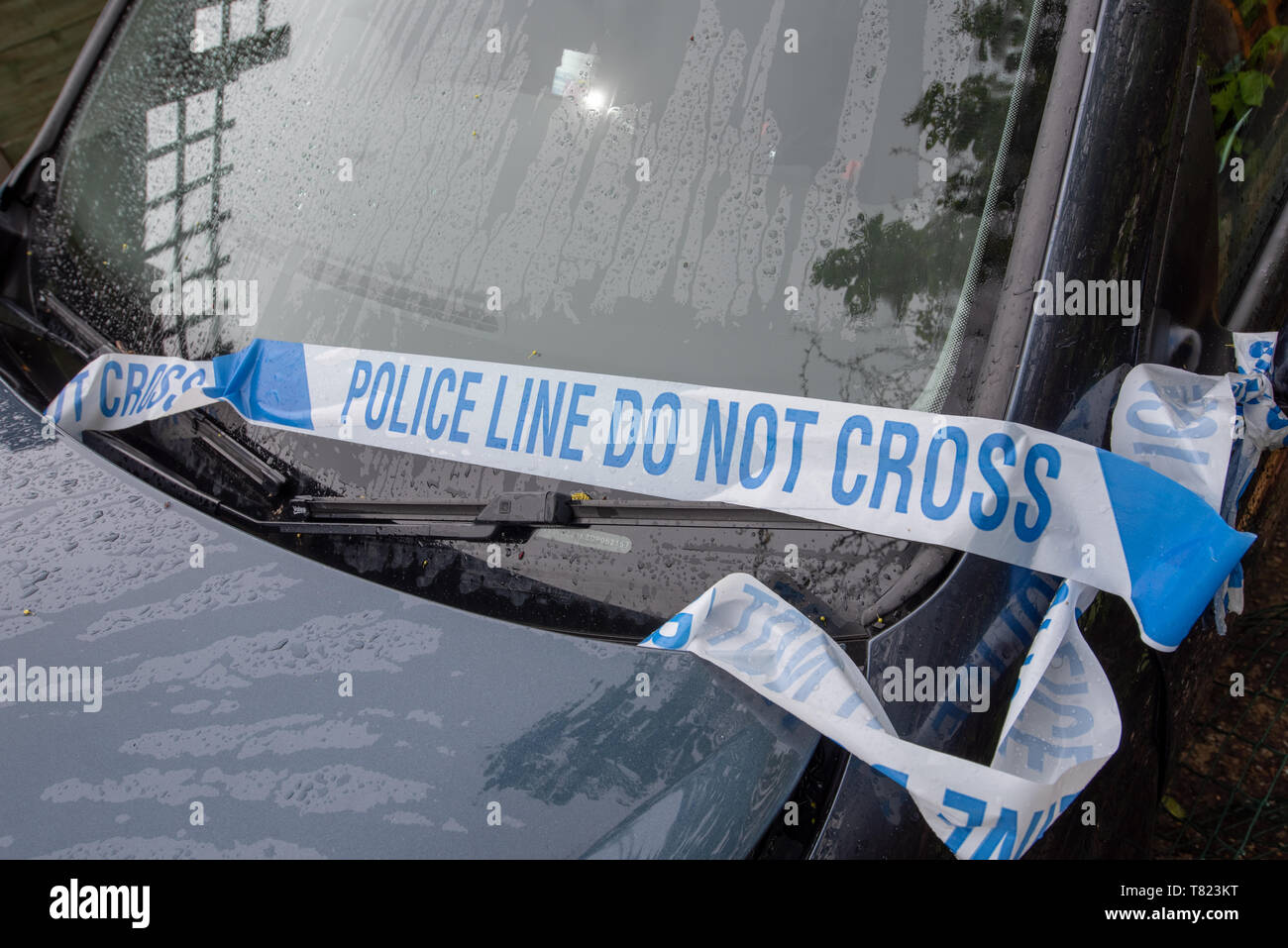 Police tape on a crashed vehicle after an accident. Car crash ...