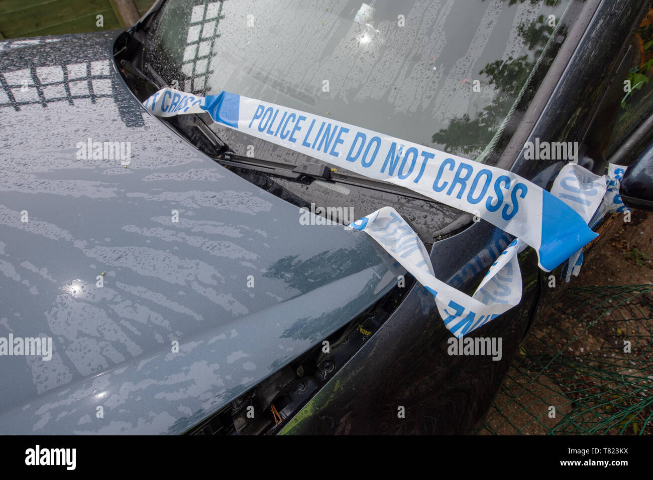 Police tape on a crashed vehicle after an accident. Car crash ...