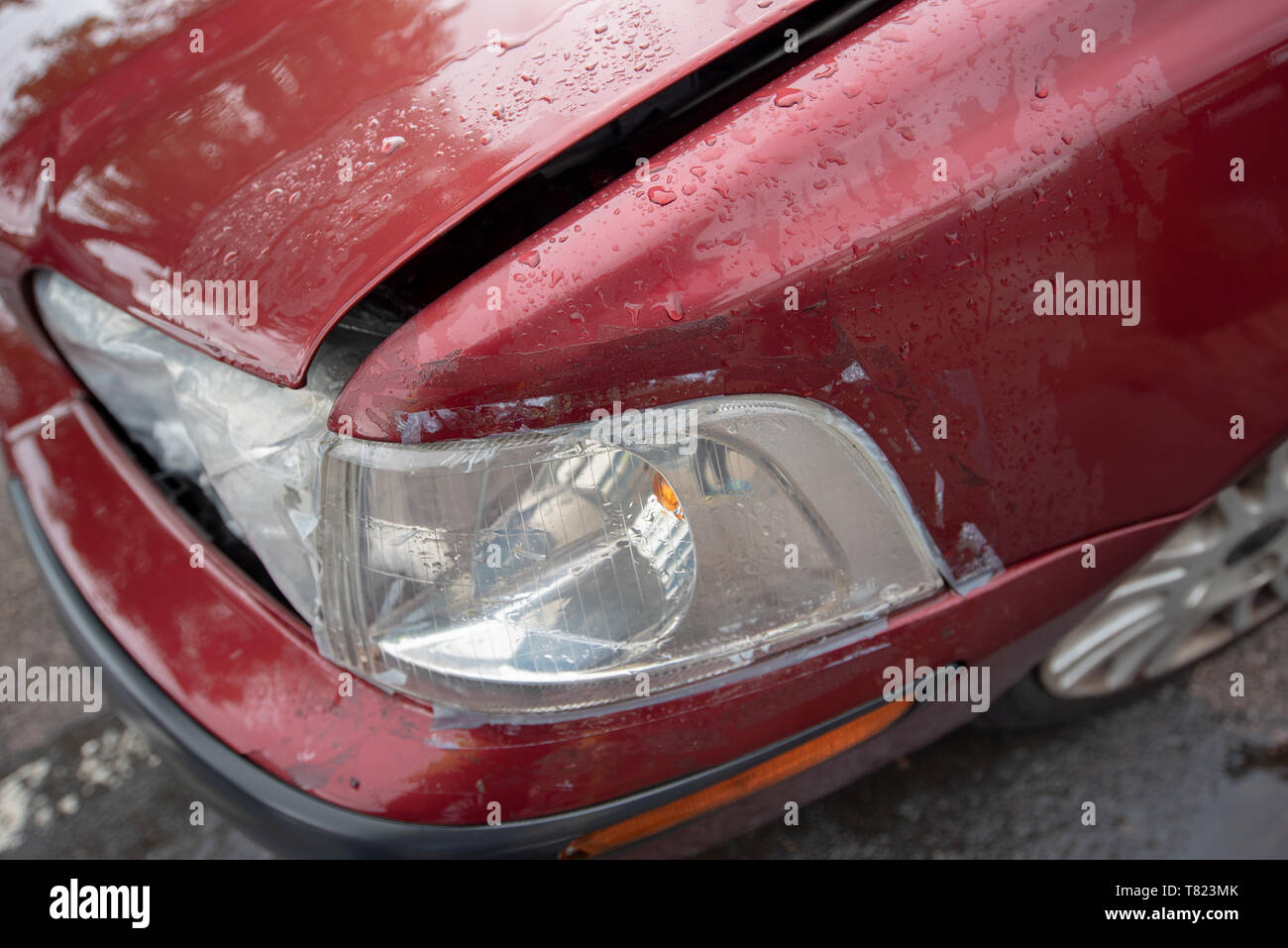 Vehicle crash. Broken headlight and damaged bumper on an old red car. Car crash background Stock ...