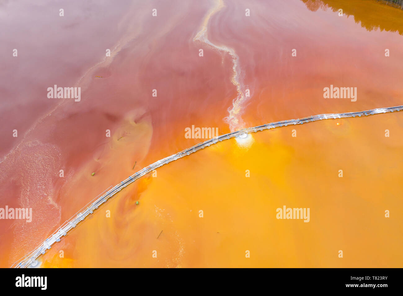 Aerial view of acid mine drainage, colorful red copper mine water ...