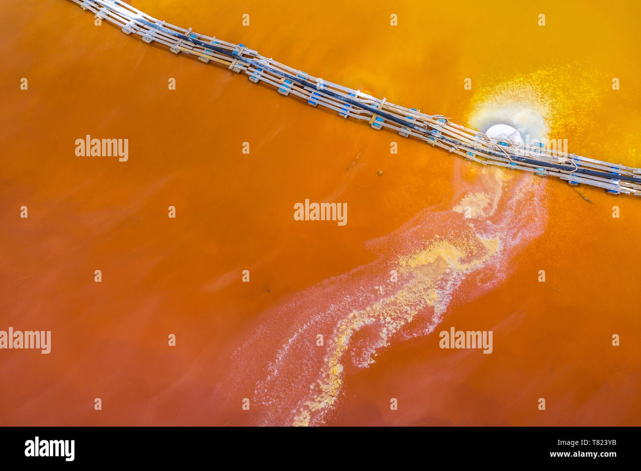 Aerial view of mining settling basin and lime supply. Colorful red ...