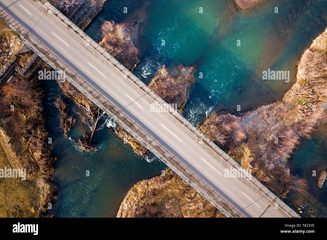 Aerial view of white bridge over blue water and stony islands Stock ...