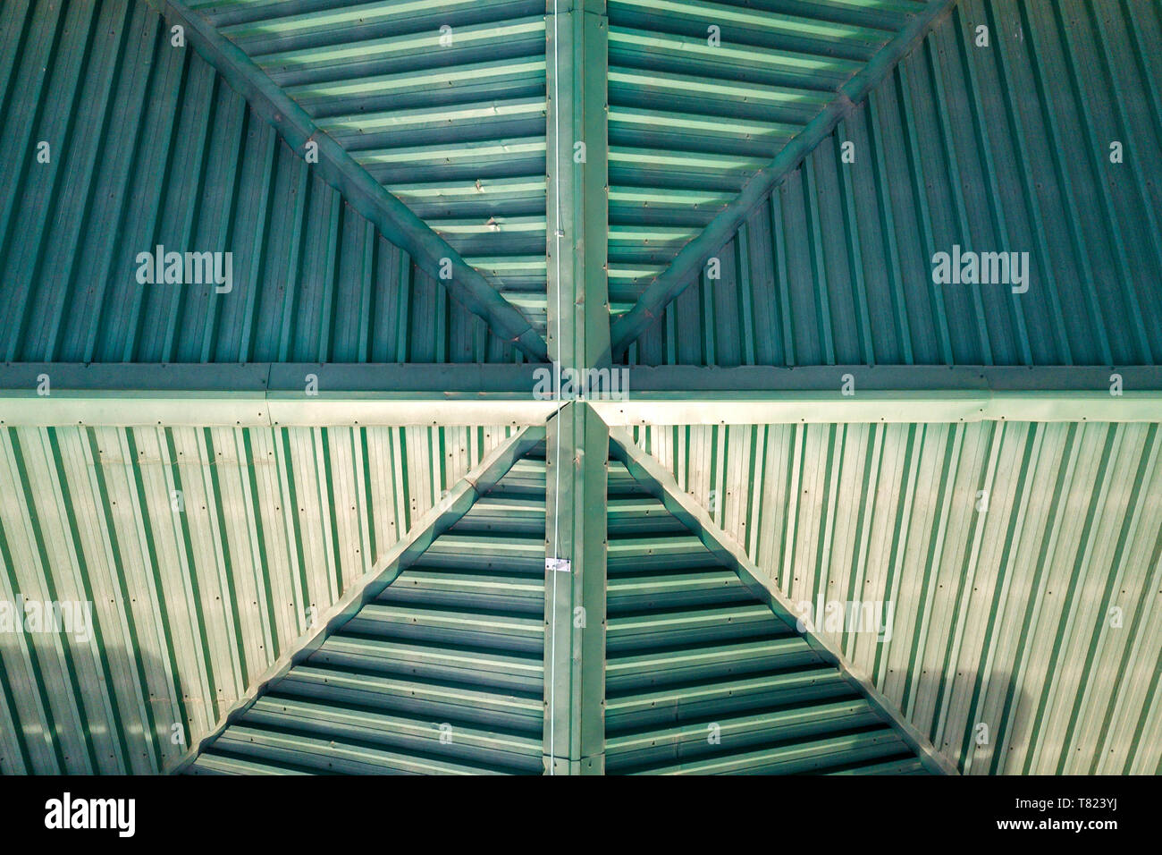 Top aerial view of building green shingle tiled roof construction ...