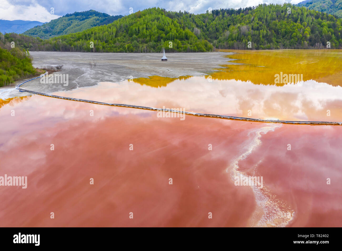 Aerial view of mining settling basin and lime supply. Colorful red ...