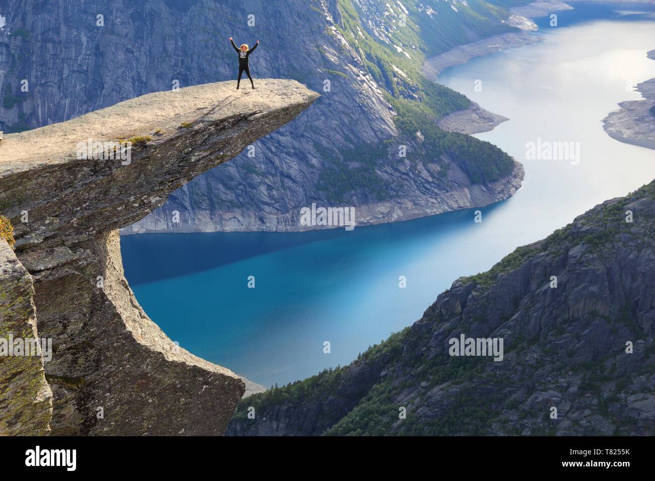 TROLLTUNGA, NORWAY - JULY 16, 2015: Tourist visits Troll's Tongue ...