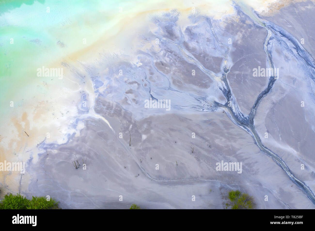 Aerial abstract pattern of colorful water and mud, nature pollution by ...