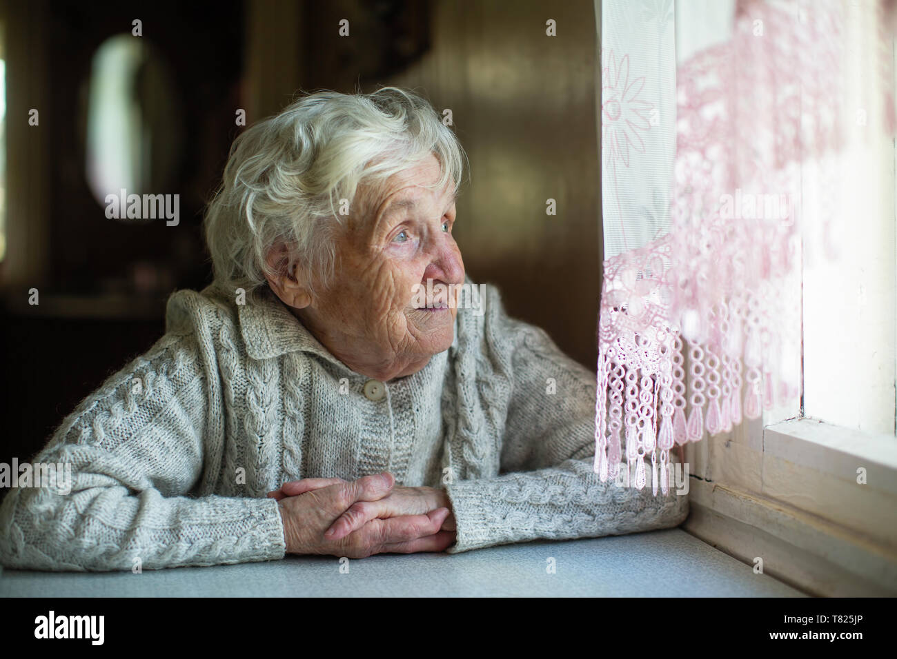 Grandma Looking Out Window High Resolution Stock Photography and Images ...