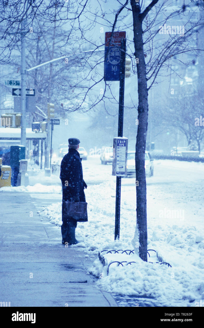 Businessman in a snowstorm, New York City, USA, 1990's Stock Photo - Alamy