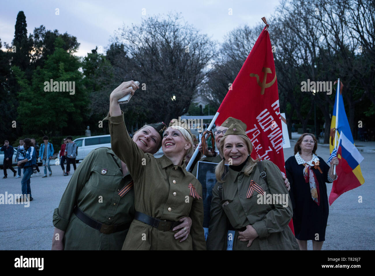 Women in USSR uniforms seen taking a selfie during the celebration ...