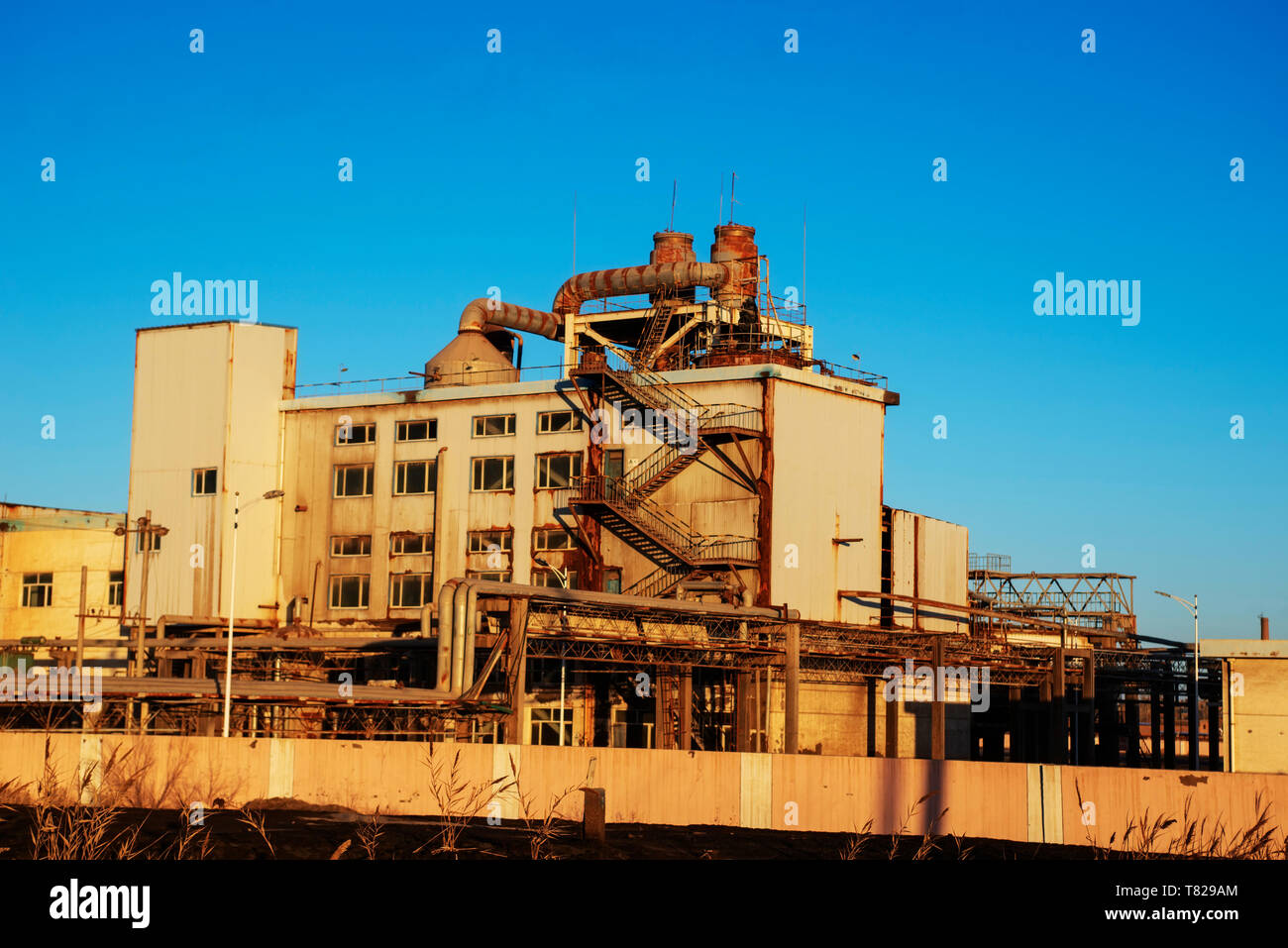 Rusty steel pipes in abandoned factory buildings Stock Photo - Alamy