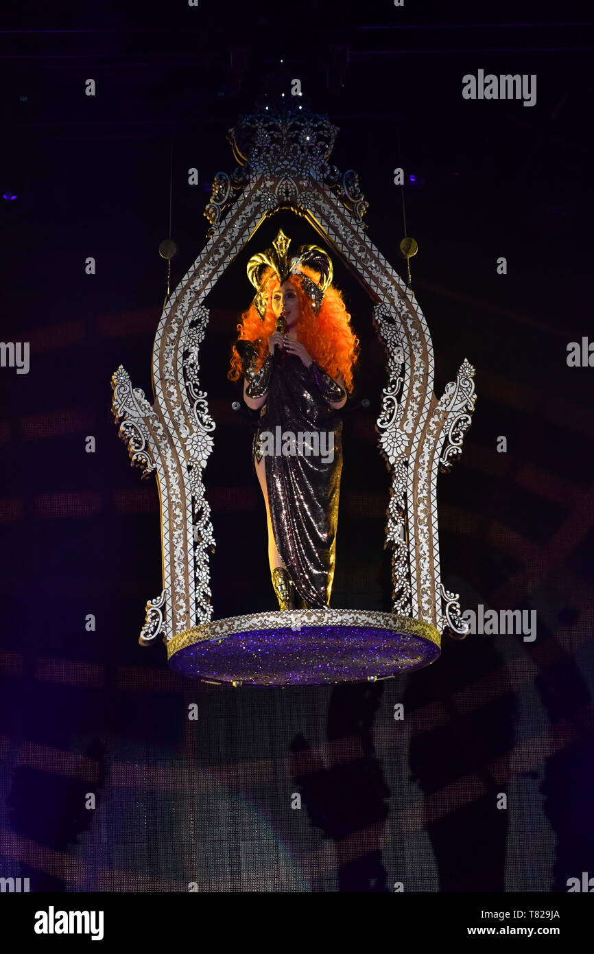 Cher is shown performing on stage during a live concert appearance ...