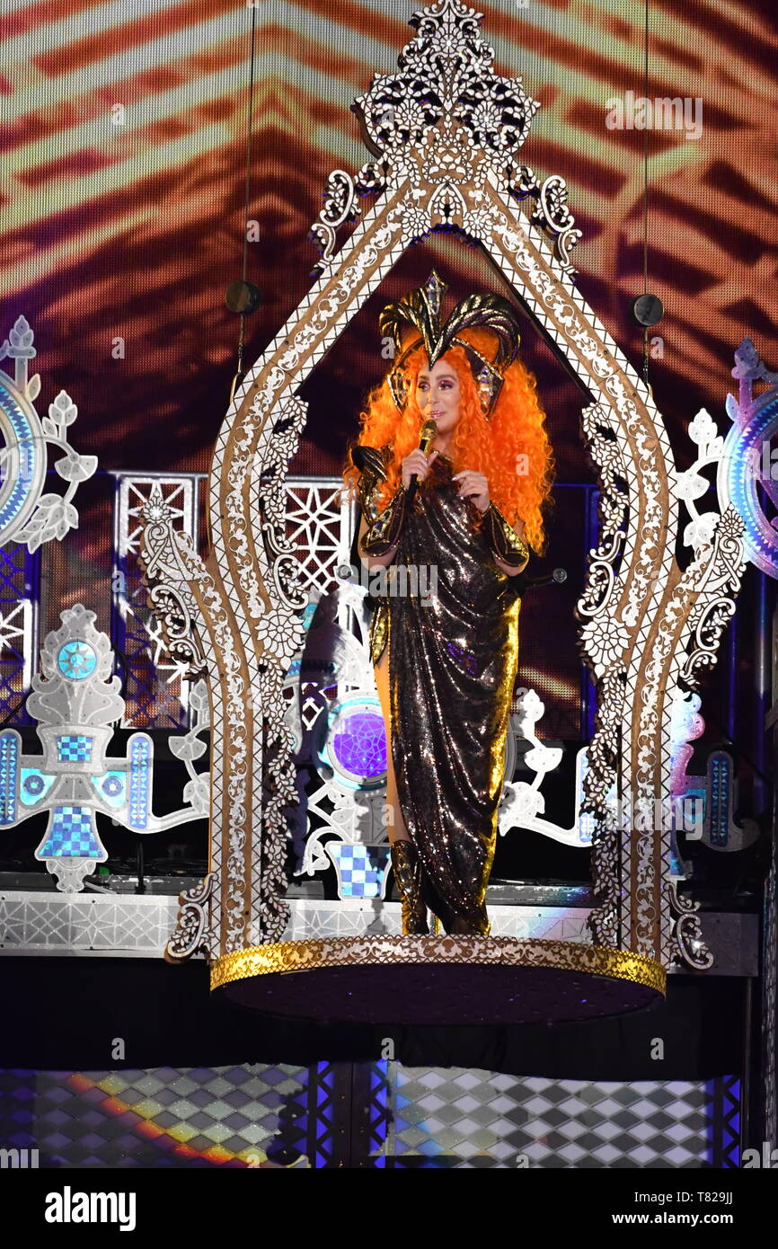 Cher is shown performing on stage during a live concert appearance ...