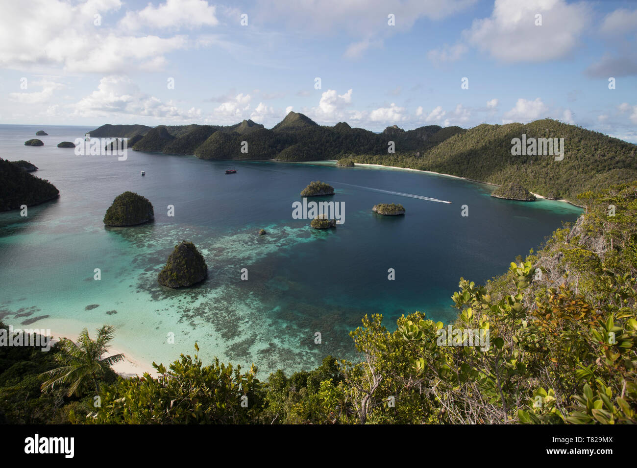 Aerial view of lagoon and karst limestone formations in Wayag Island ...