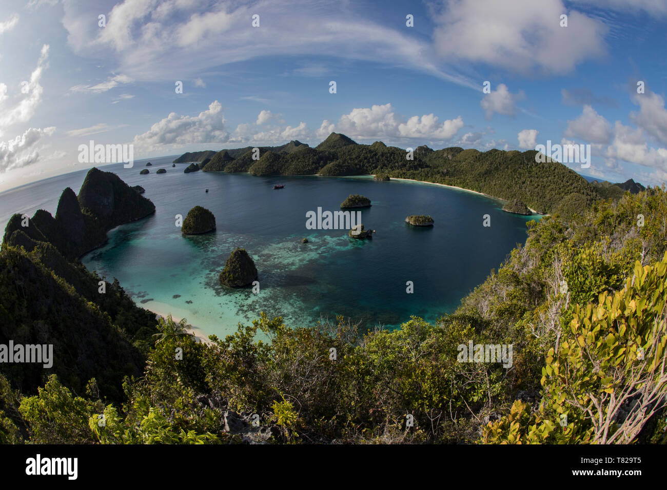 Aerial view of lagoon and karst limestone formations in Wayag Island ...