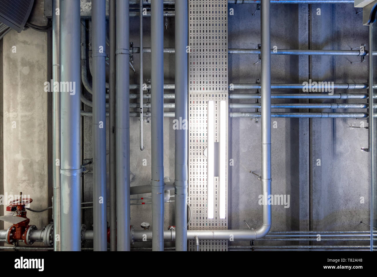 Steel pipes system network on mortar ceiling in building Stock Photo ...