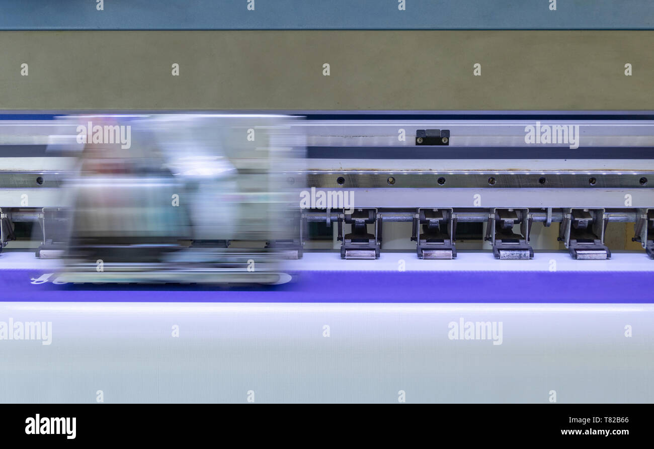 Large inkjet printer with head printing on white vinyl banner Stock ...