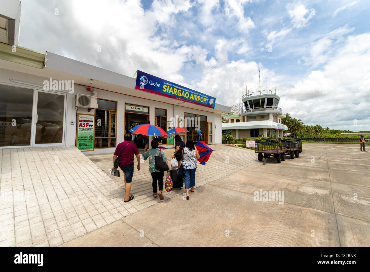 Apr 26, 2019 Passengers walking to airport arrival terminal at Siargao ...