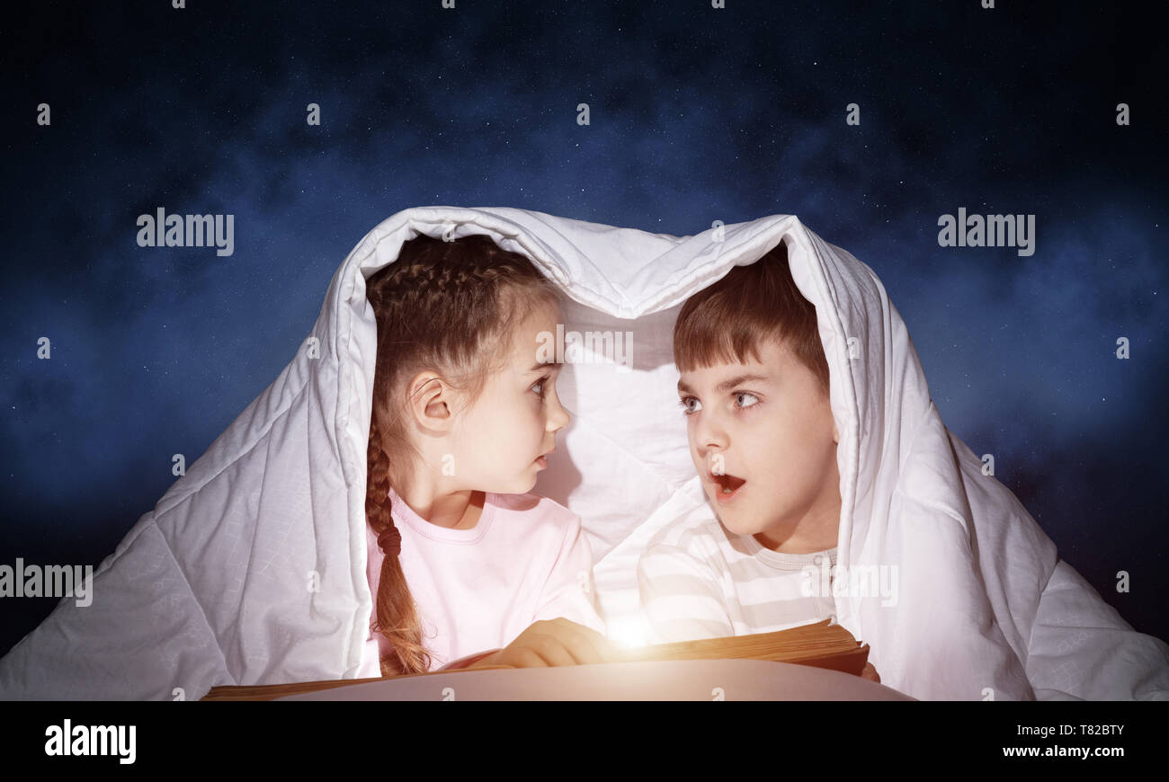 Scared little girl and boy looking at each other Stock Photo - Alamy