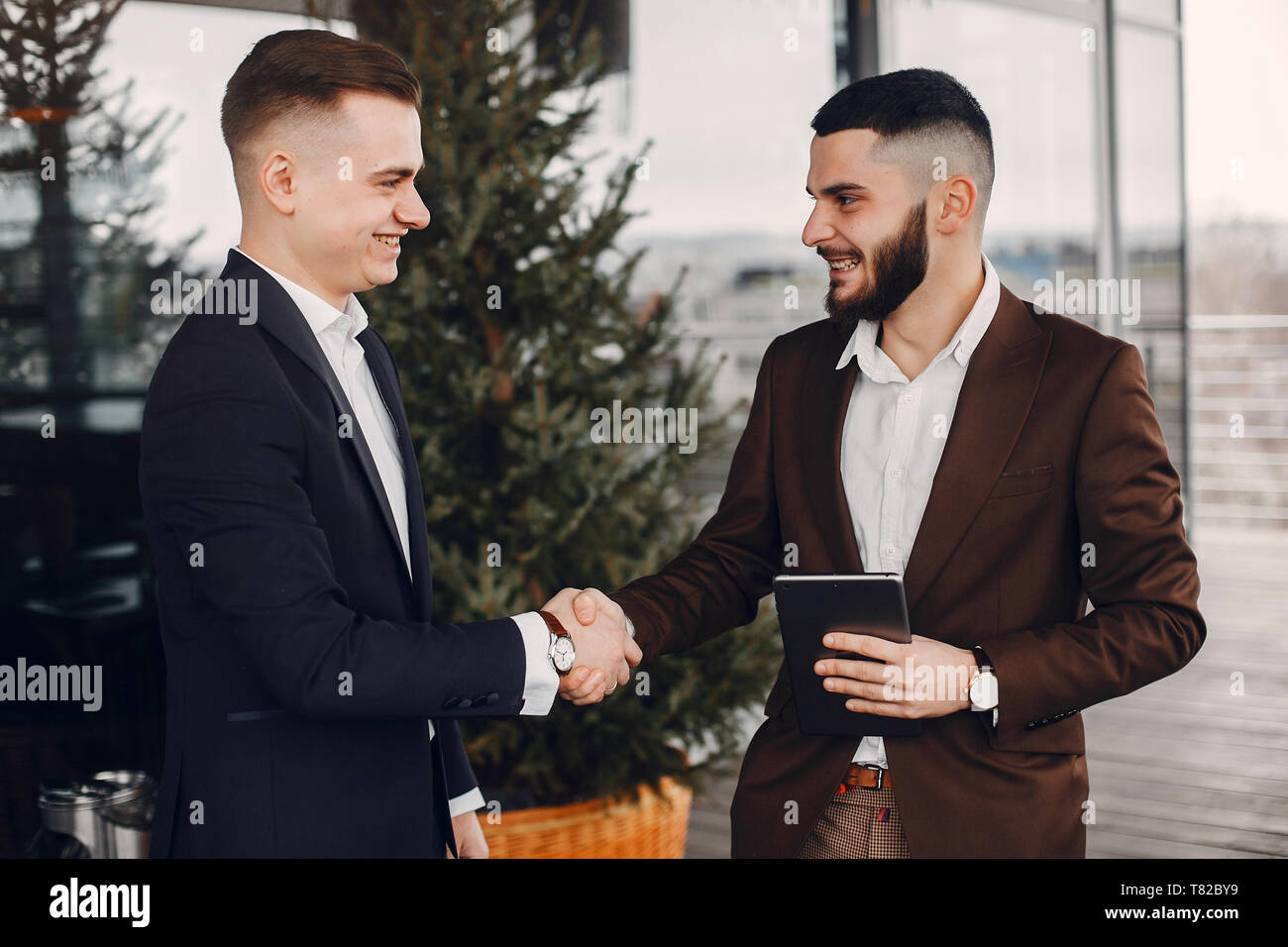 Two handsome men working. Friends talking. Man in a suit Stock Photo ...