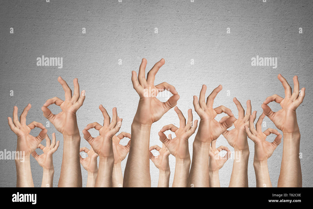 Row raised hands showing hi-res stock photography and images - Alamy