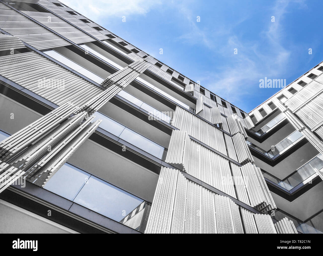 Modern building against stunning sky. Bottom view Stock Photo - Alamy