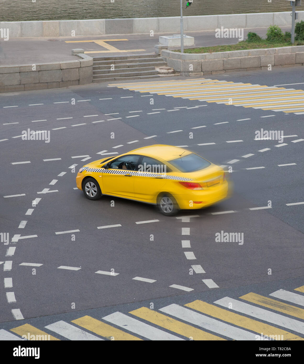 yellow taxi moves on the city street Stock Photo - Alamy