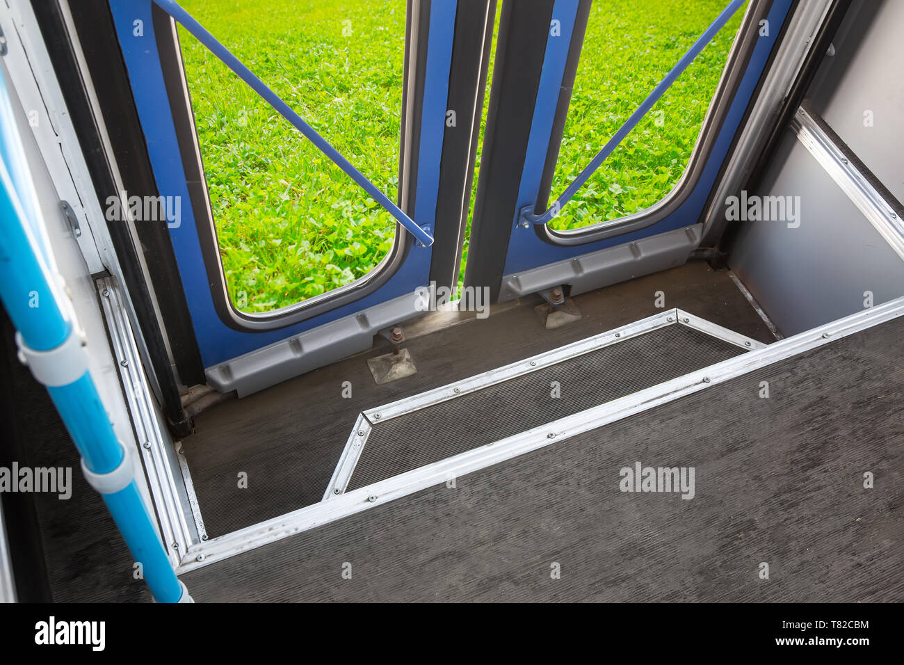 closed city bus doors from the inside Stock Photo - Alamy