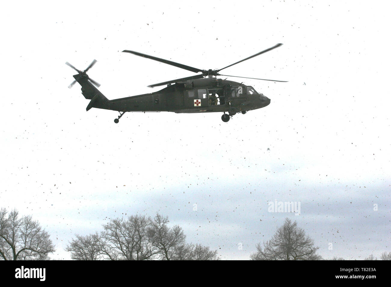 A Blackhawk helicopter prepares to land near the Medical Simulation ...