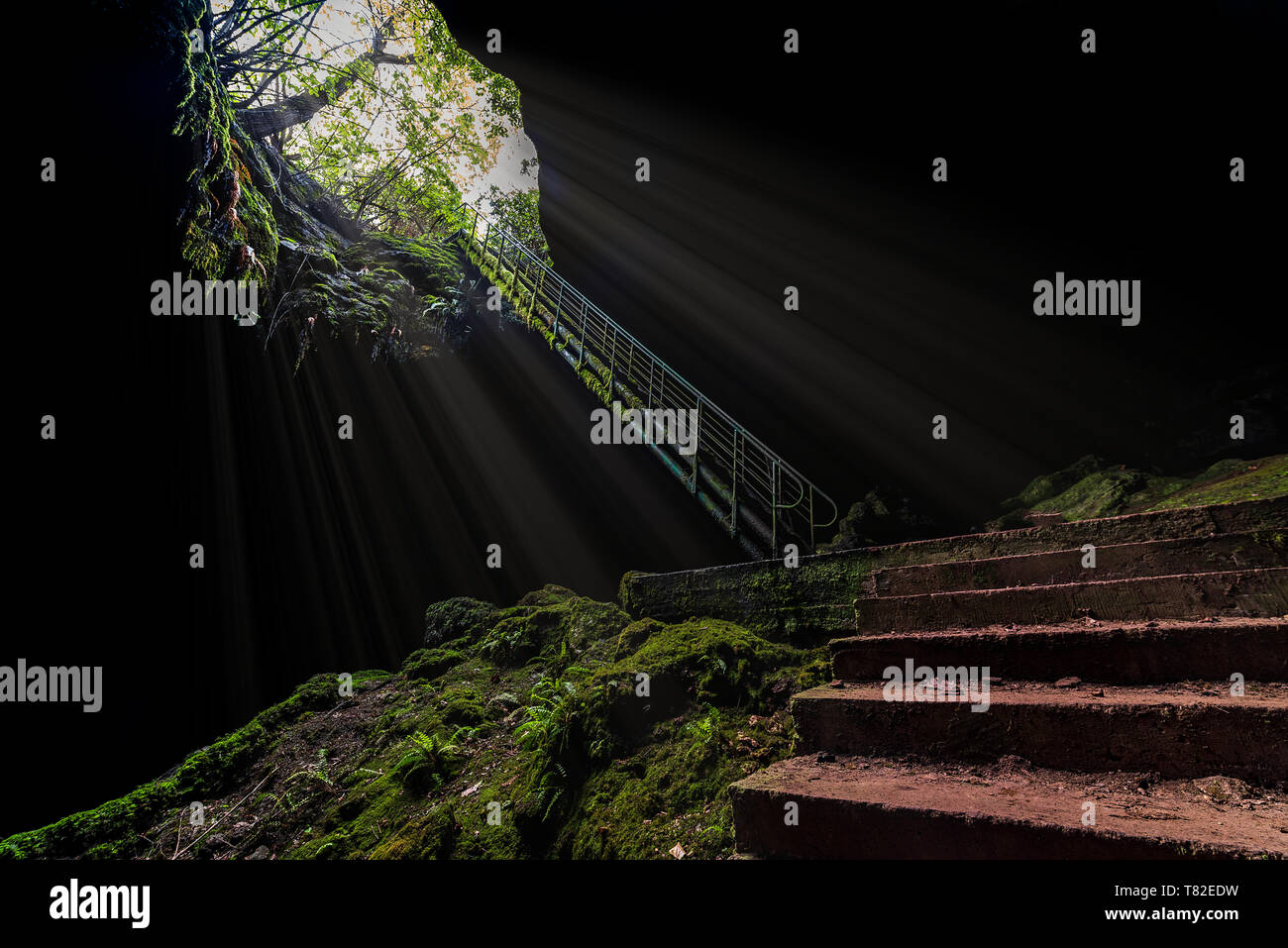 Underground cave "the stairs" in Bulgaria with sun rays from hole in ...