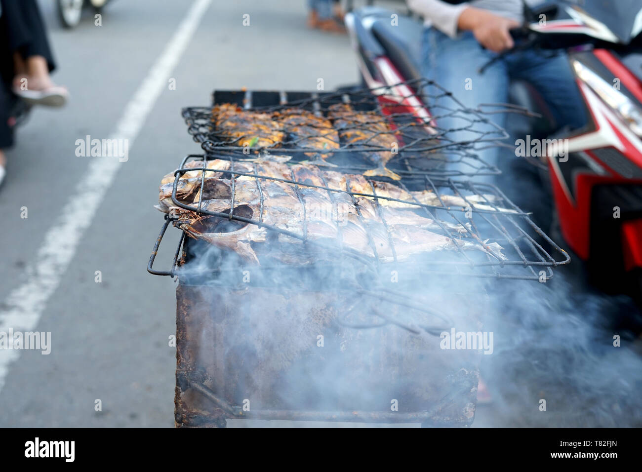 Fish on Grilled at ramadan street food in Indonesia Stock Photo - Alamy