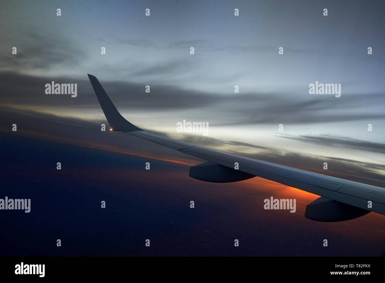 Beautiful shot of the wing of an airplane in flight with amazing clouds ...