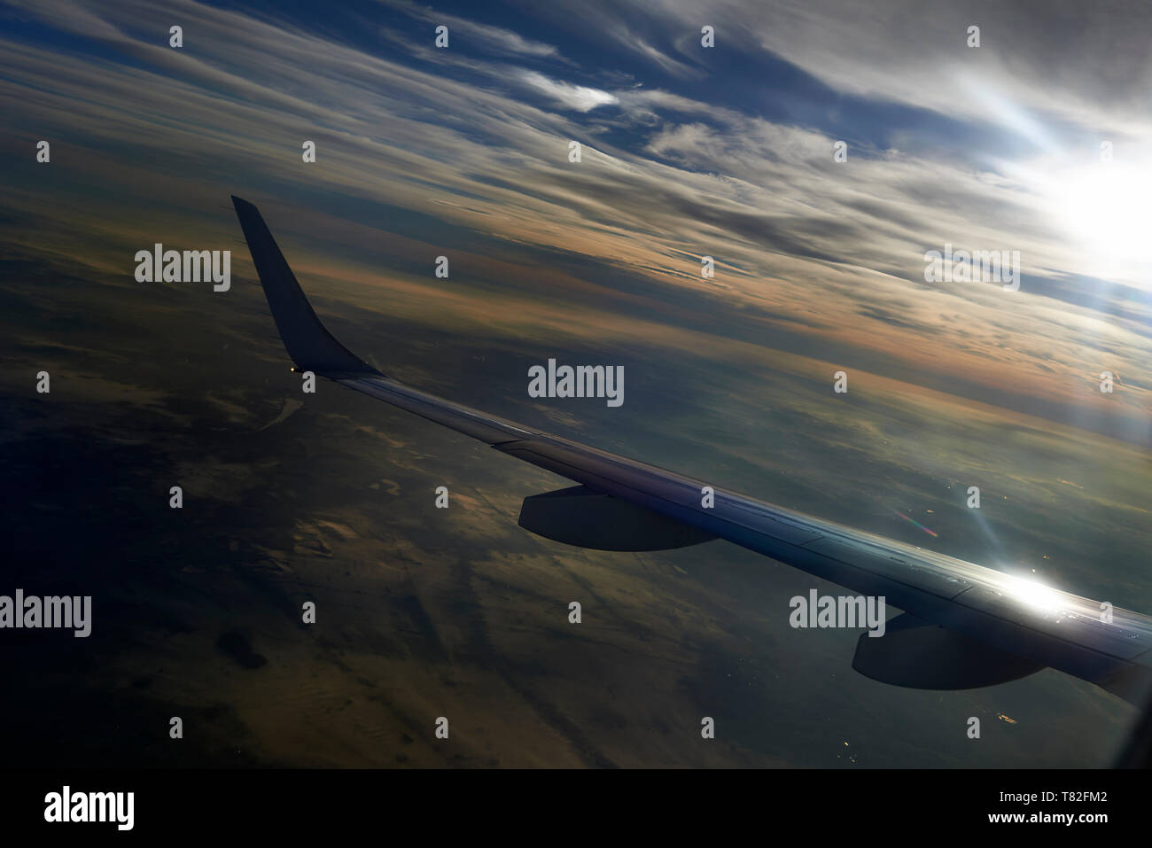 Beautiful shot of the wing of an airplane in flight with amazing clouds ...