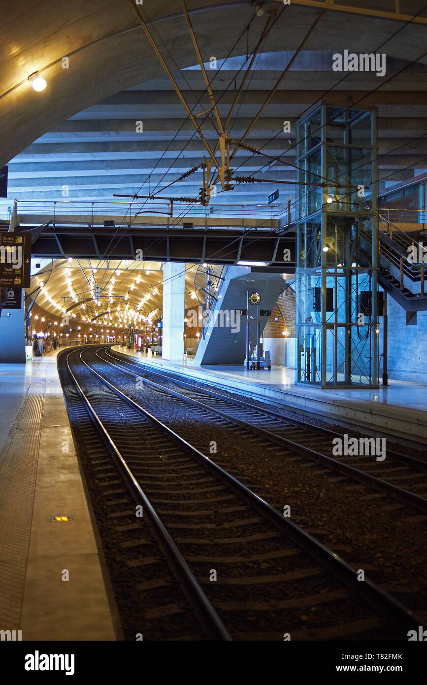 Shots of the train station entrance and tracks at Gare de Monaco in ...