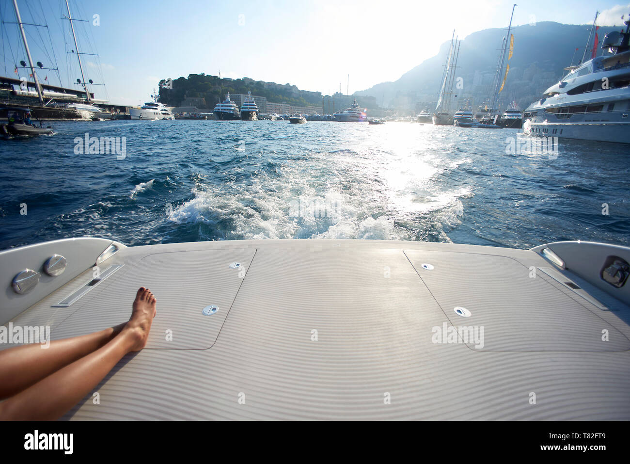 Close up of the side of a modern luxury speed boat having fun racing in ...