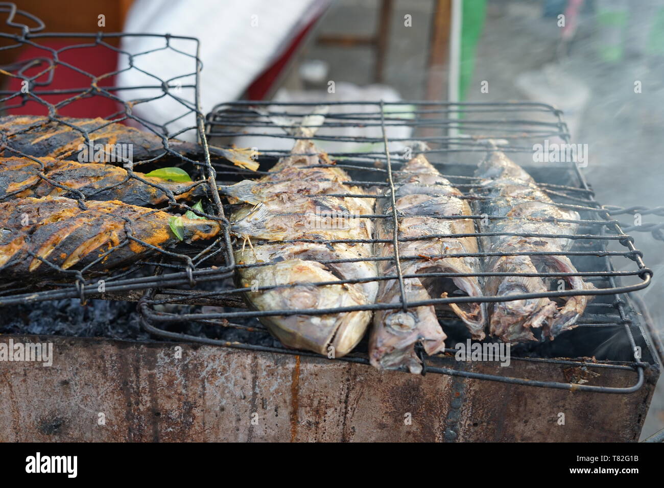 Fish on Grilled at ramadan street food in Indonesia Stock Photo - Alamy