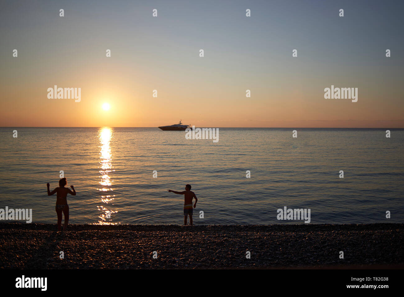 Young couple going for his healthy routine early morning swim in the ...