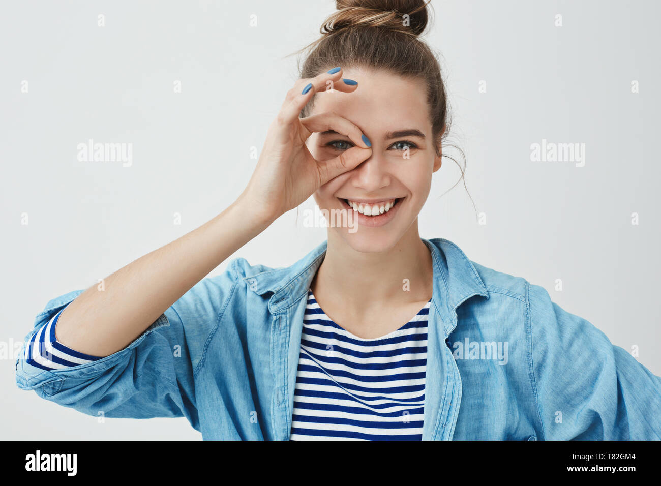 Waist-up optimistic lucky good-looking cute caucasian female hairbun ...