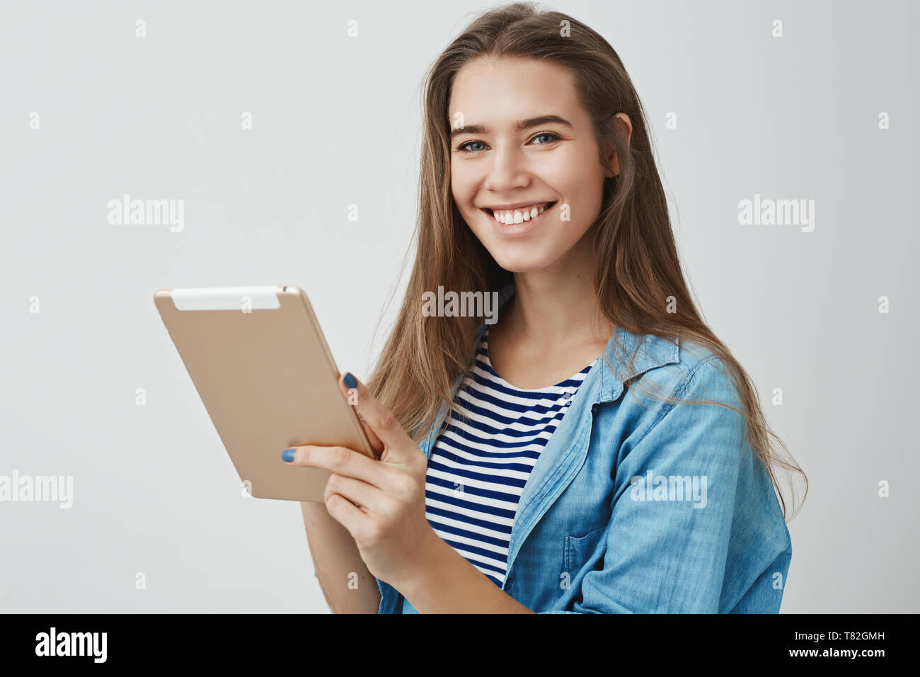 Happy friendly gorgeous female assistant ready help out answer customer ...