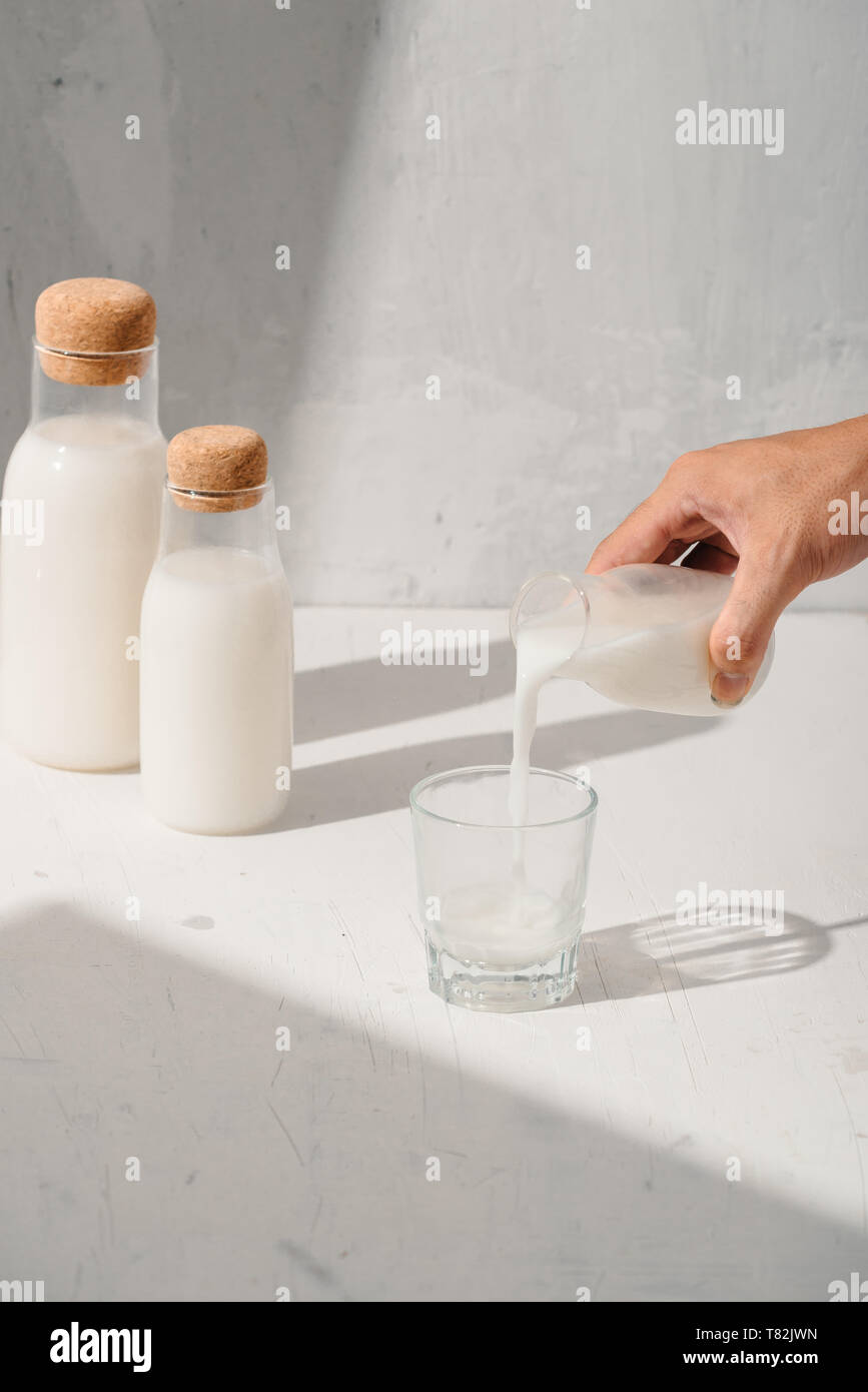 Woman pour milk calcium vitamin hi-res stock photography and images - Alamy