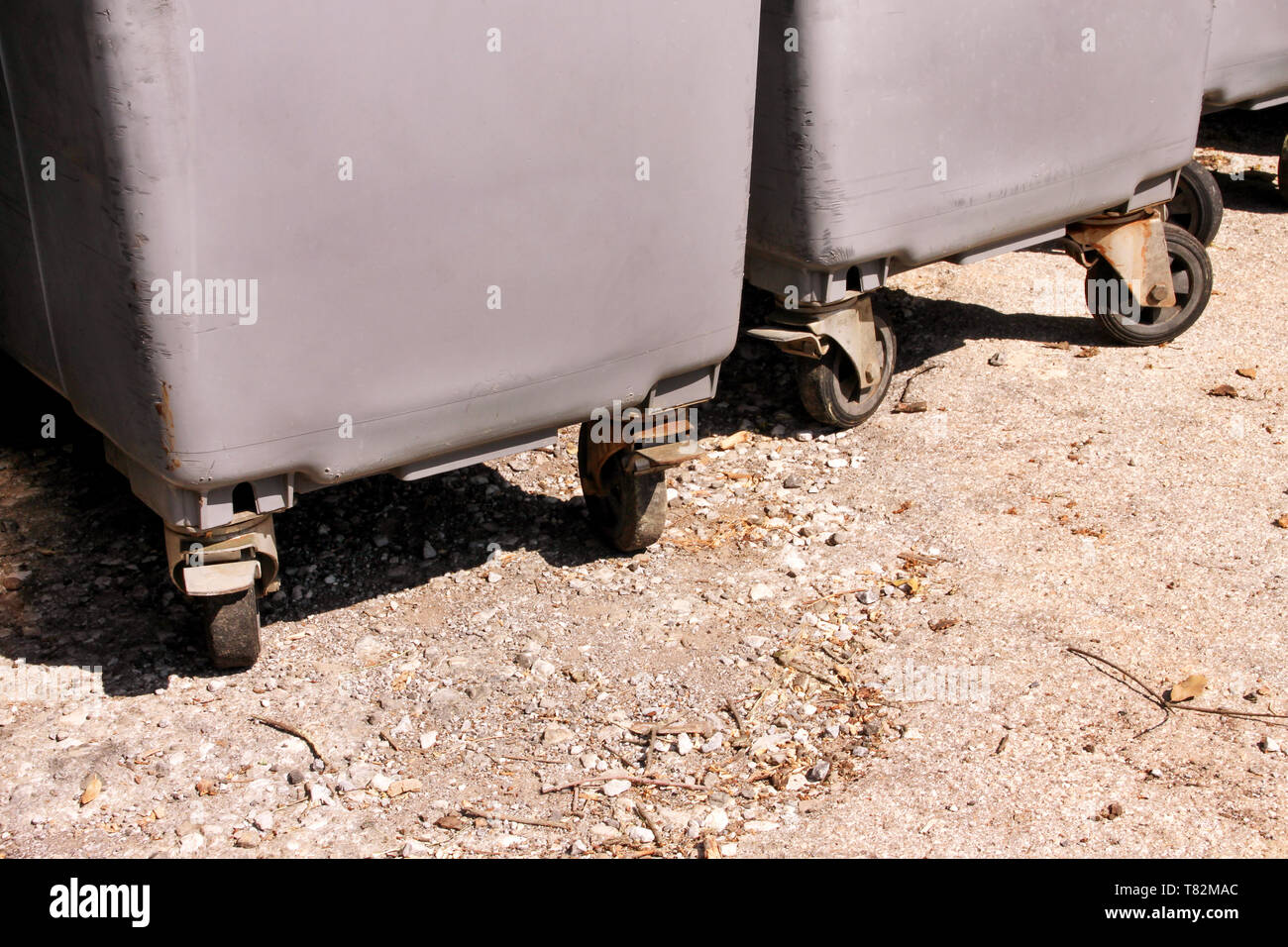 Large garbage containers, trash dumpsters and bins standing in row ...