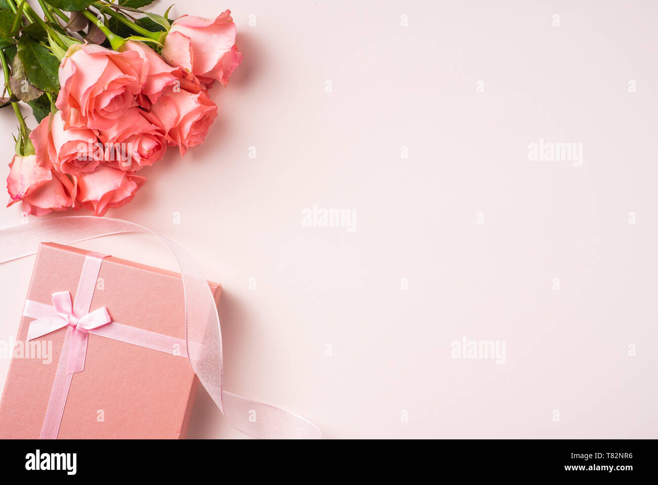 event design concept - top view of a bunch of pink rose , gift box and ...