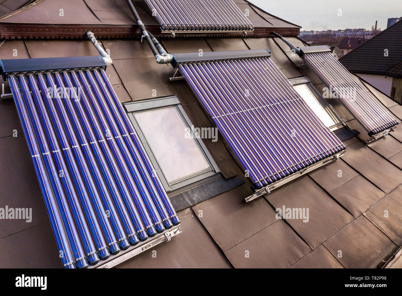 Solar water heating system on house roof. Hot water boiler, alternative ...