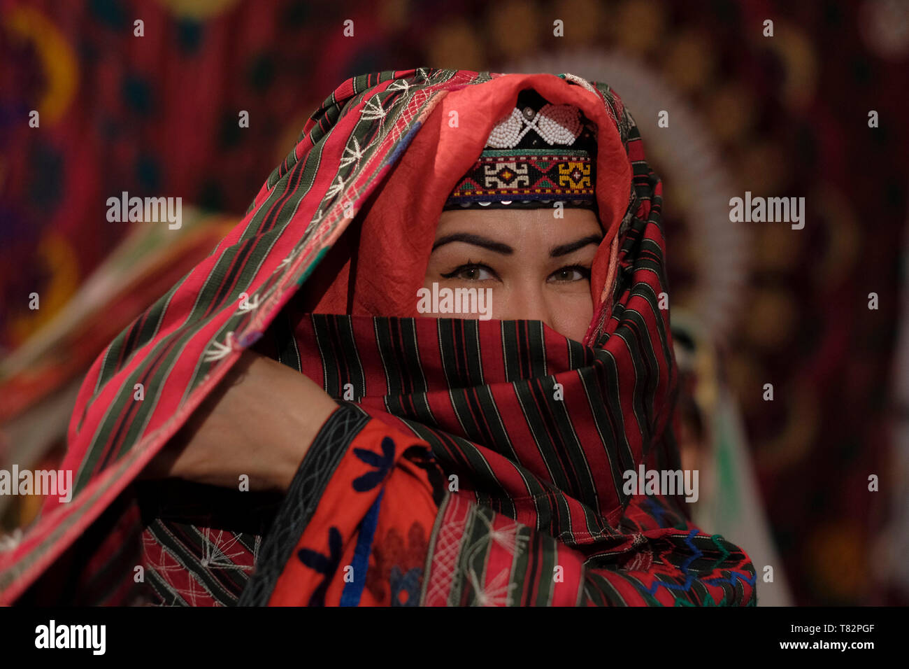 Uzbek woman wearing traditional silk embroidered costume in the ...