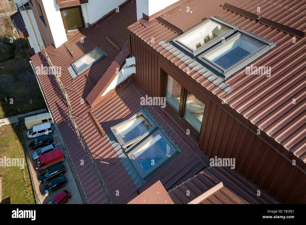 Aerial view of annex room exterior with plastic attic windows, roof and ...