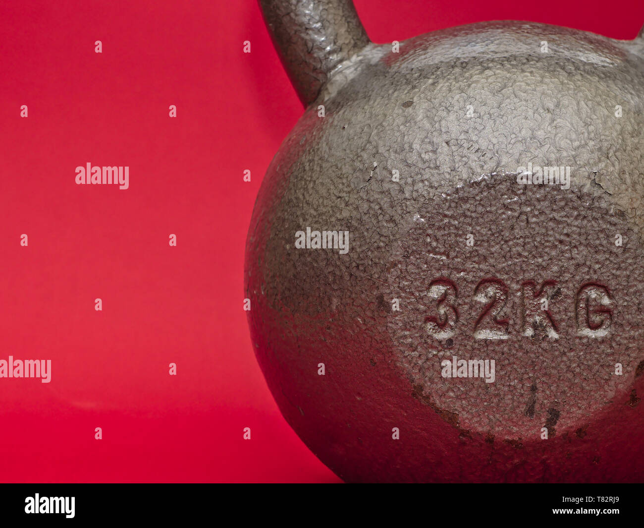 32 kg kettlebell isolated on magenta pink background Stock Photo - Alamy