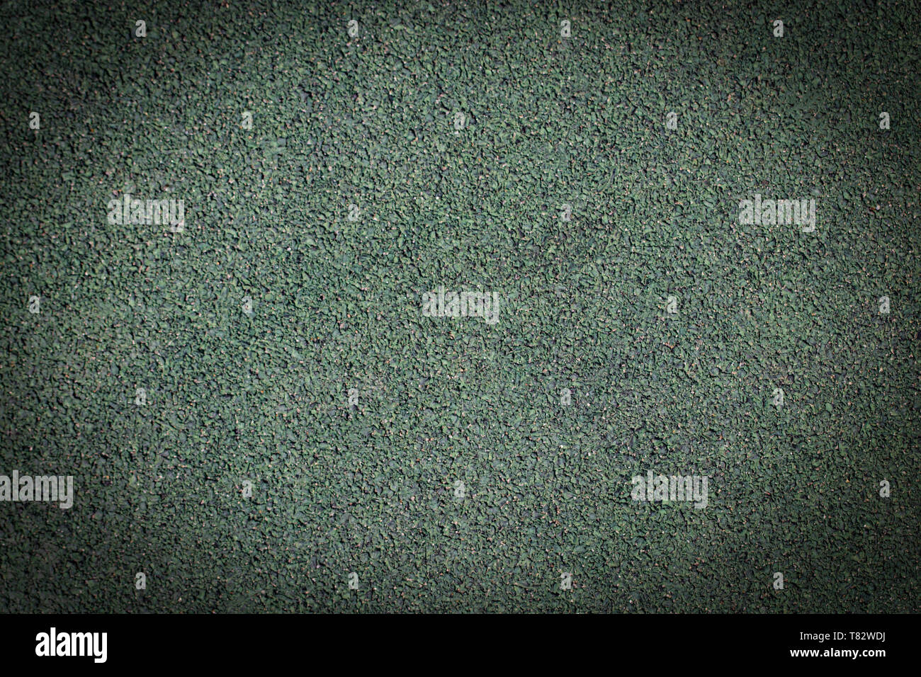 green background with spotlight. Asphalt texture background Stock Photo ...
